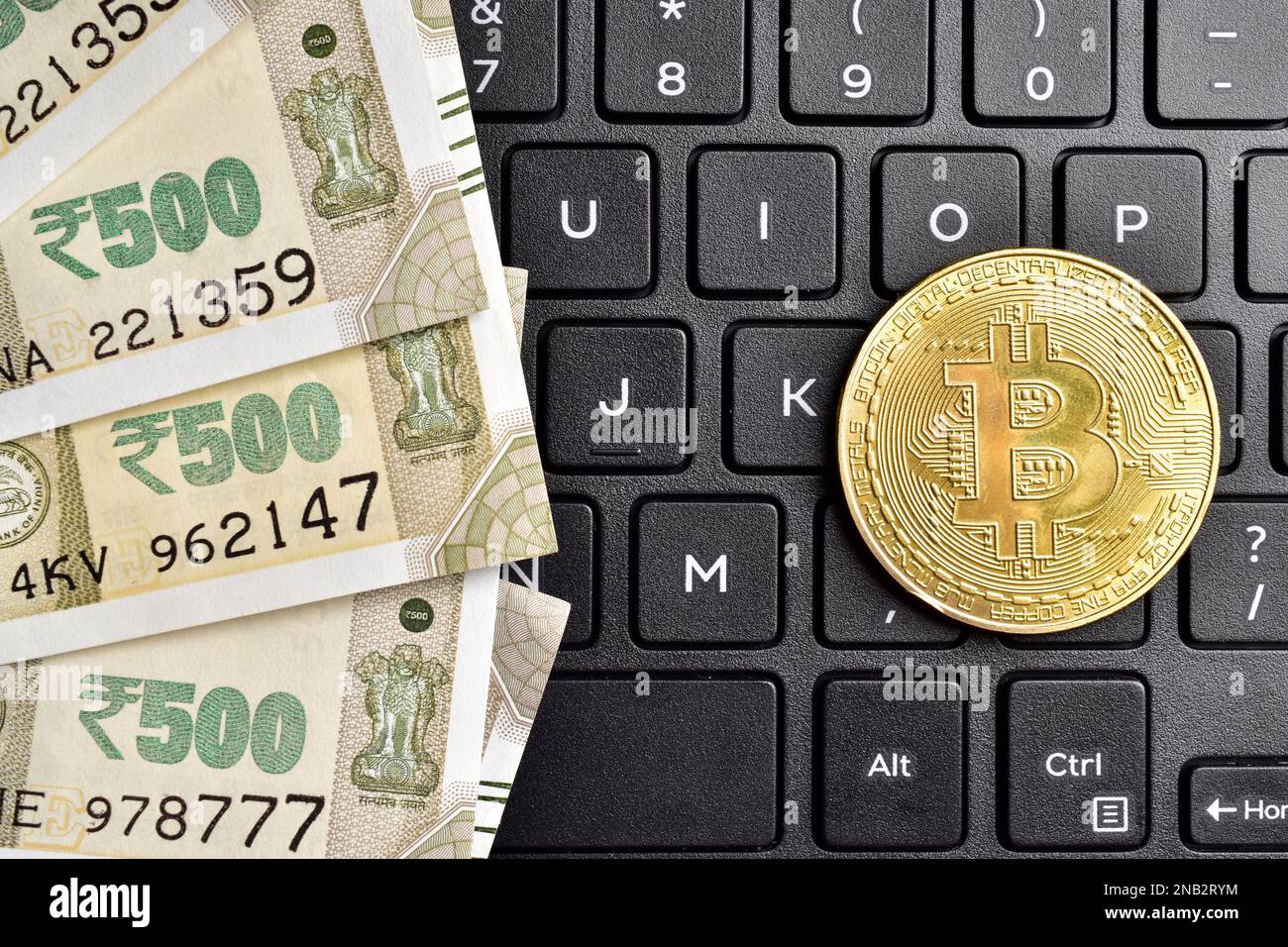 Cryptocurrency bitcoin with indian rupees note Stock Photo - Alamy