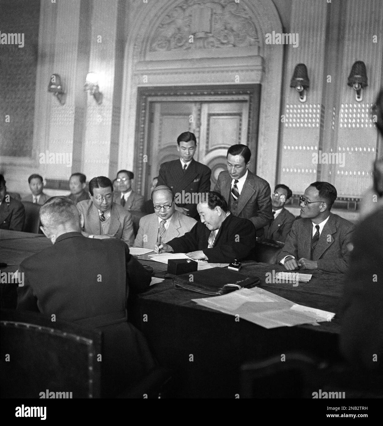 Korean officials and SCAP spokesmen representing occupied Japan signed ...