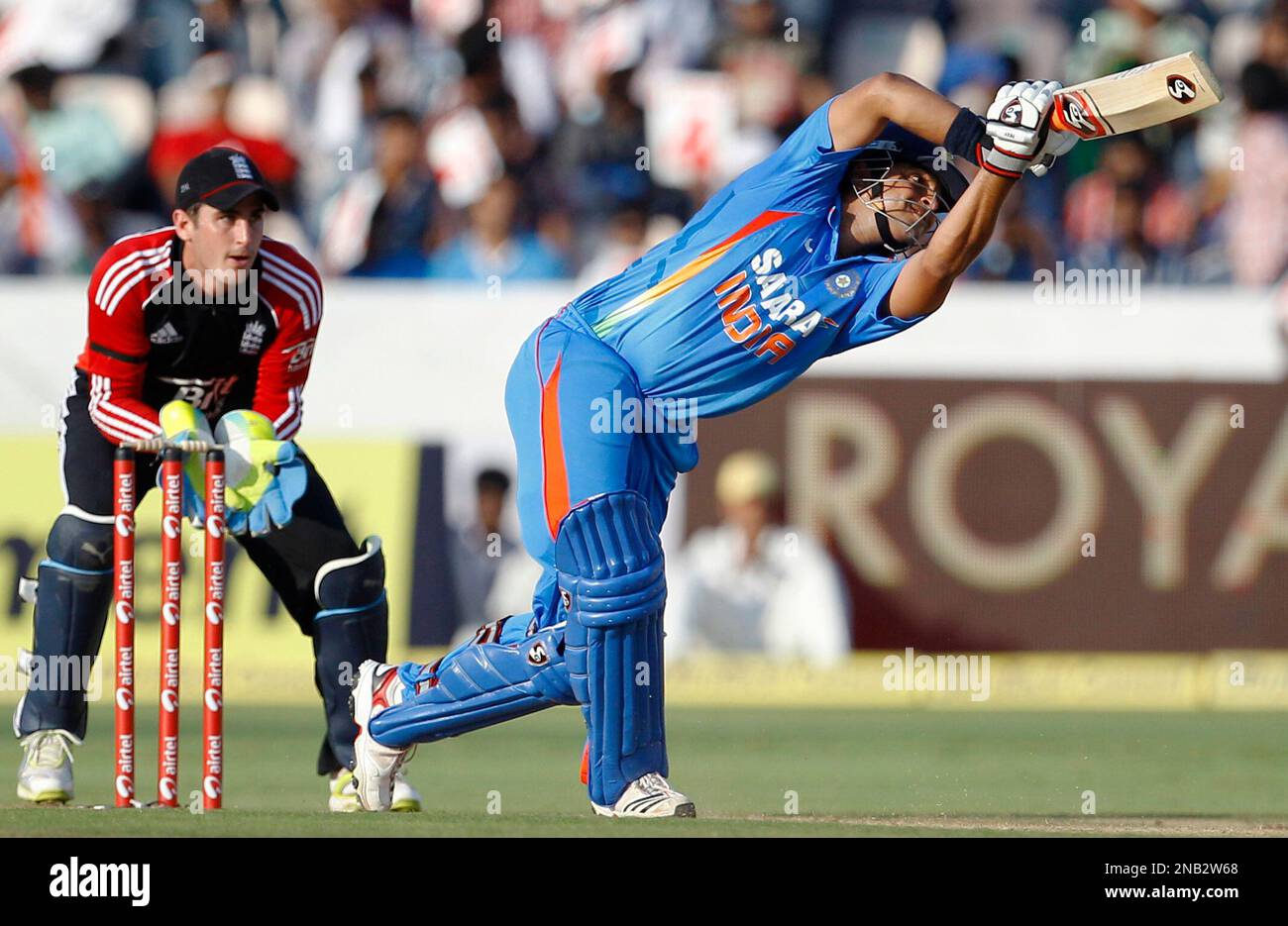 India's batsman Suresh Raina, right, plays a shot as England's ...