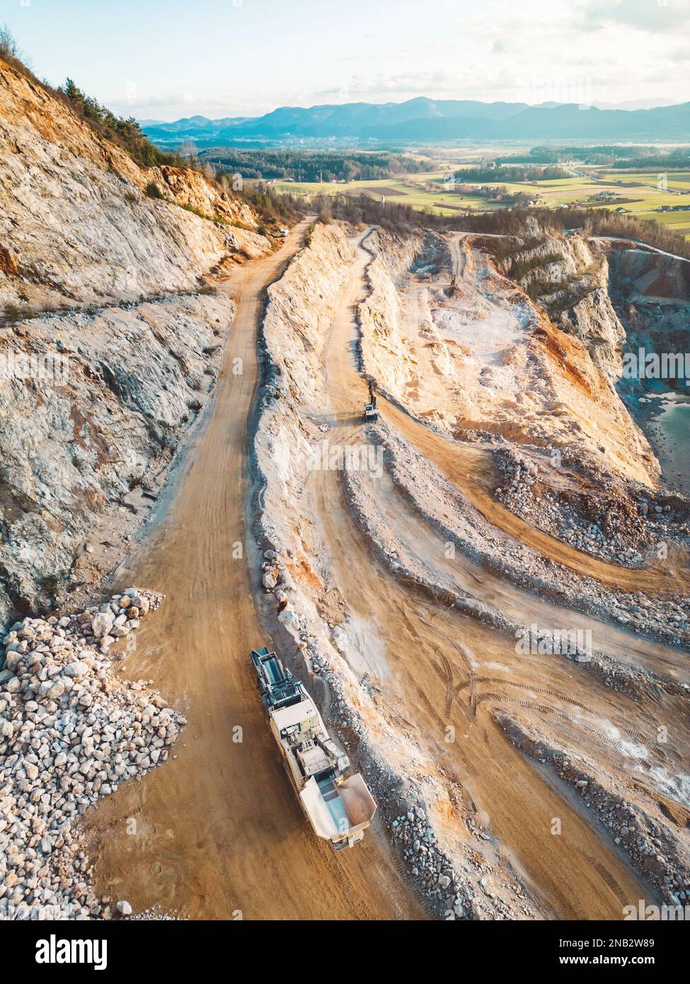 Vertical photo of gravel roads on the side of the open pit quarry Stock ...