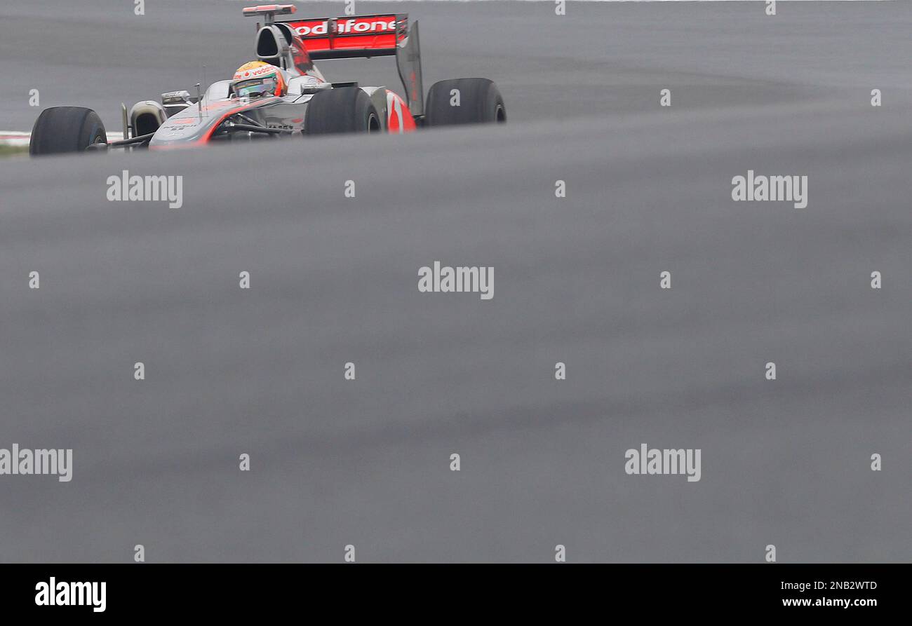 McLaren driver Lewis Hamilton of Britain steers his car during a ...