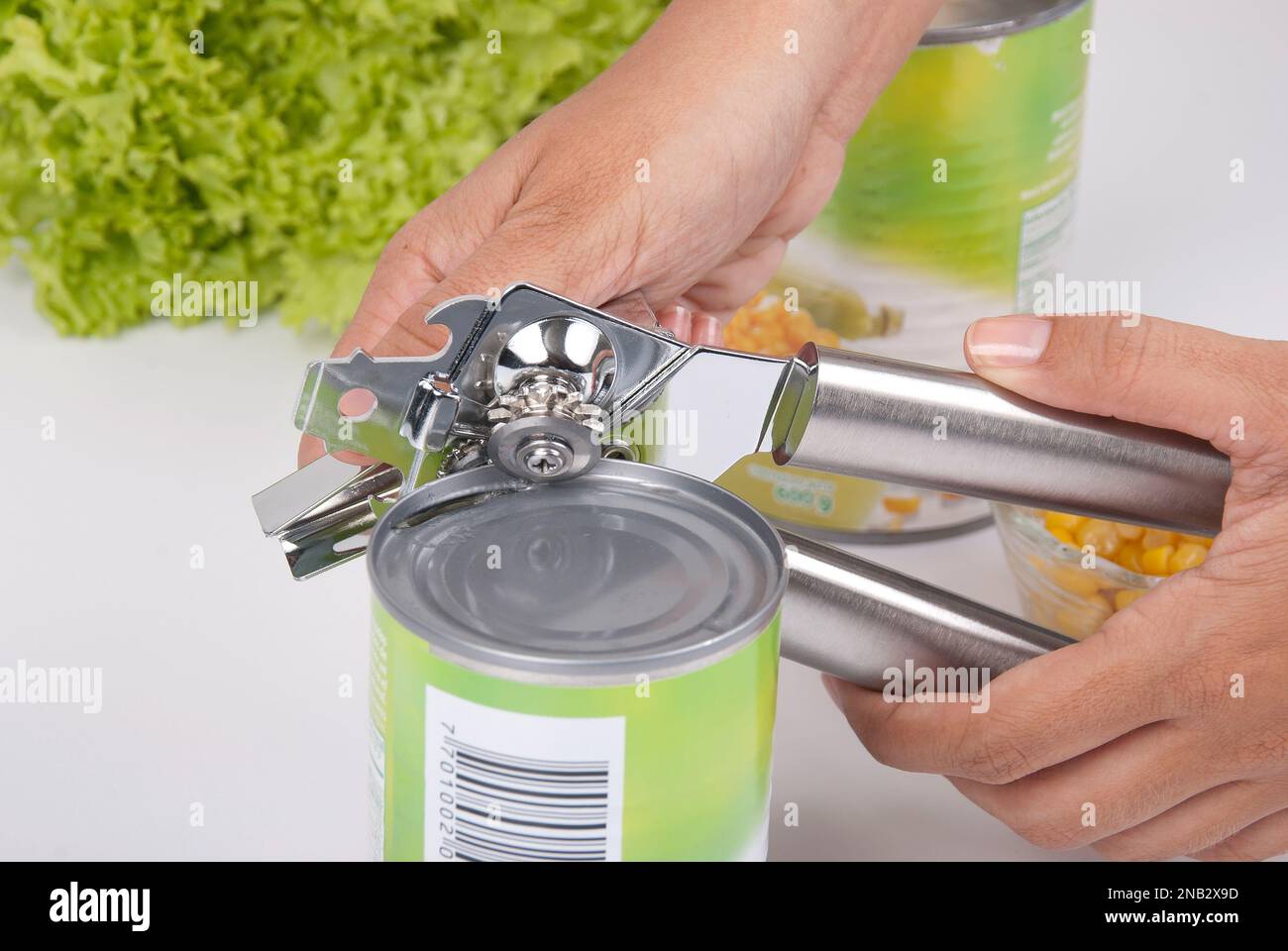 Using a can opener hi-res stock photography and images - Alamy