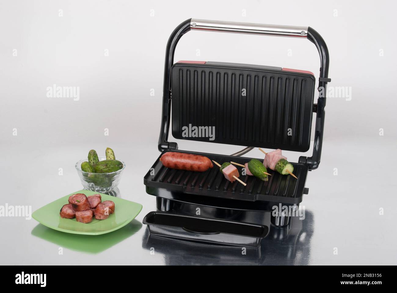 Open panini machine; Photo on neutral background Stock Photo - Alamy