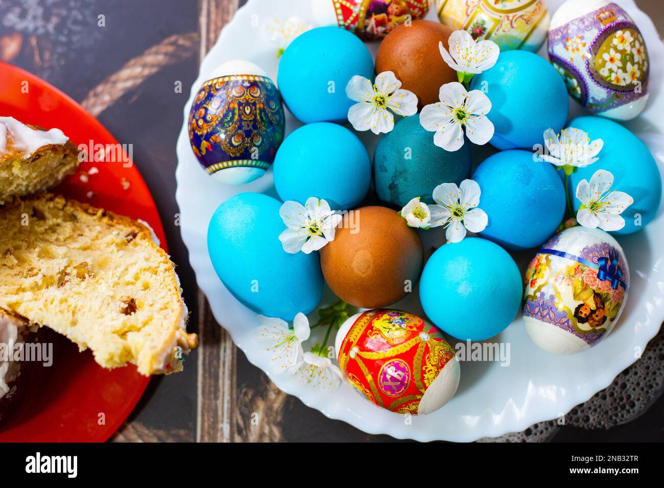 The Feast of Holy Easter. Painted eggs and Easter Kuliches on dishes ...