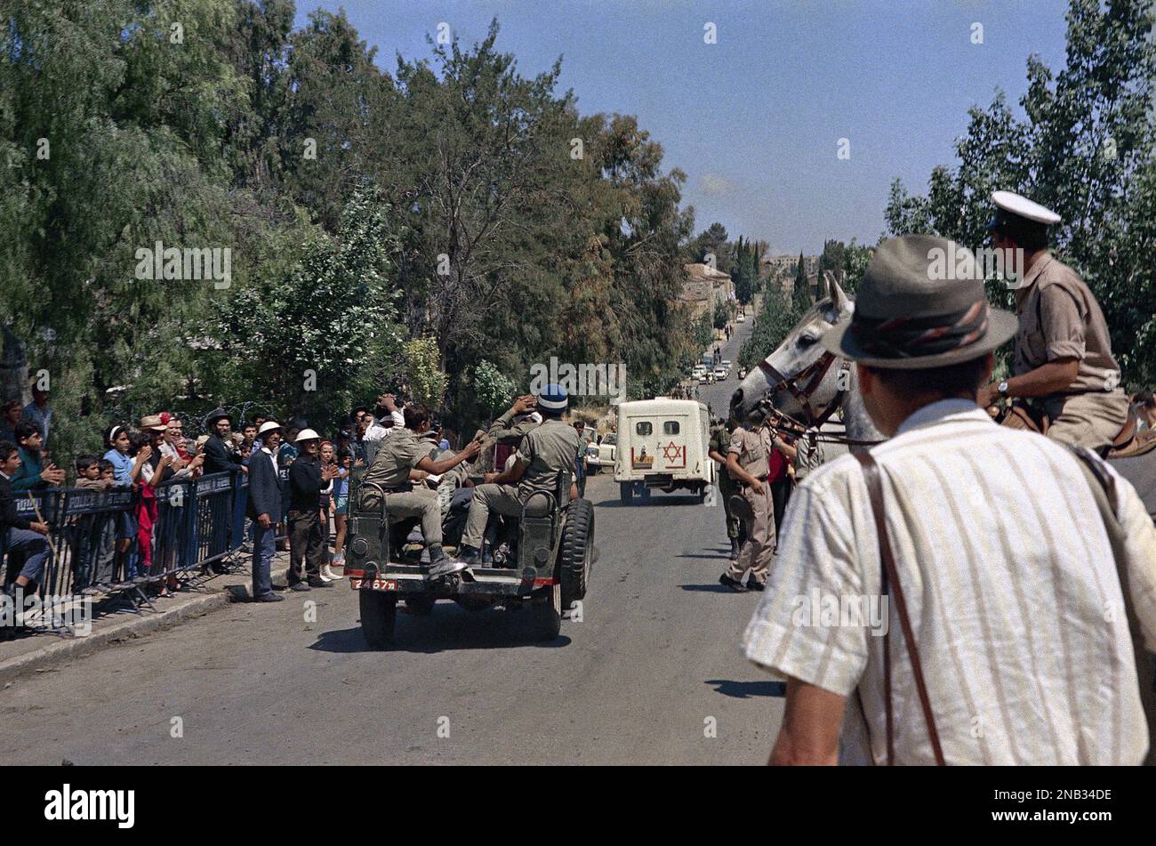 Israeli troops and armor roll through a street in Jerusalem in June ...