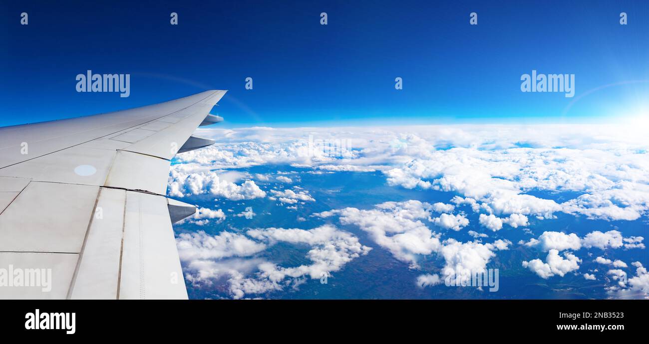 Concept of airplane travel. Flying above the city. Scenery sunset ...