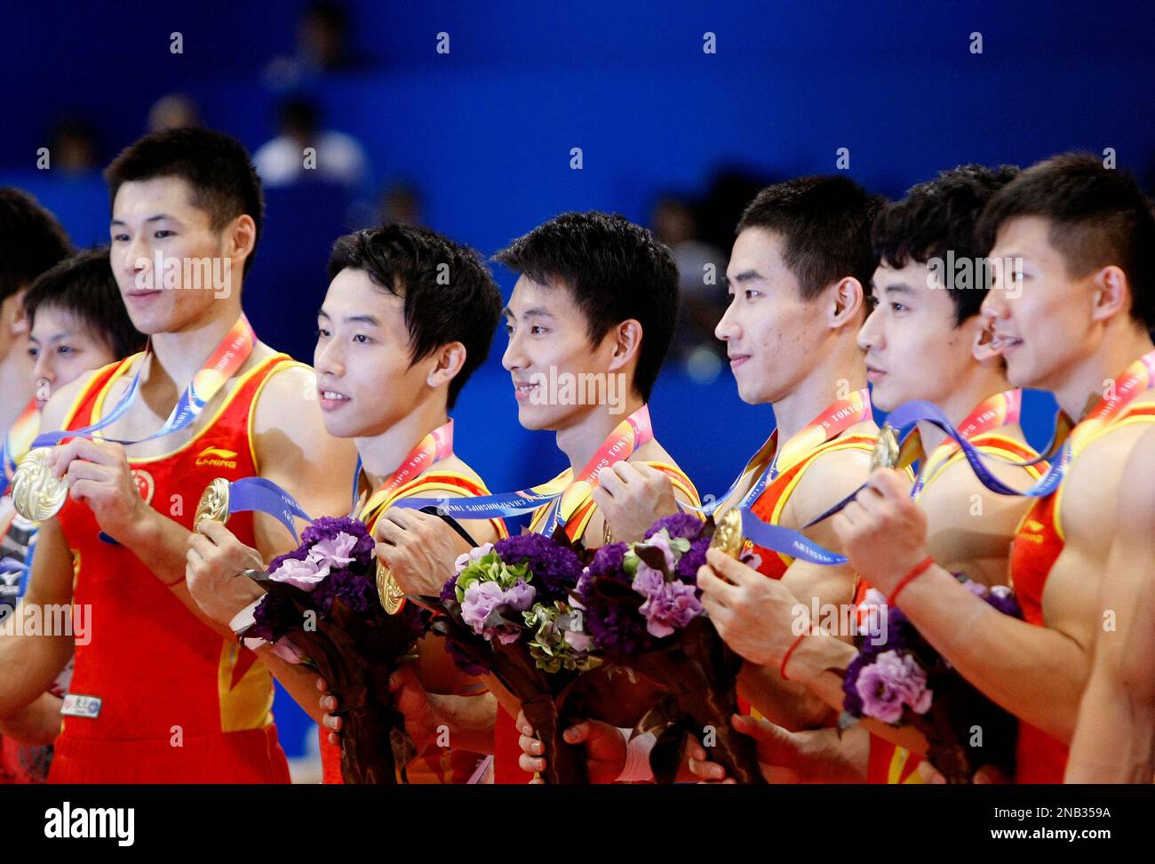 China's gymnasts, from left, Zhang Chenglong, Zou Kai, Teng Haibin, Yan ...