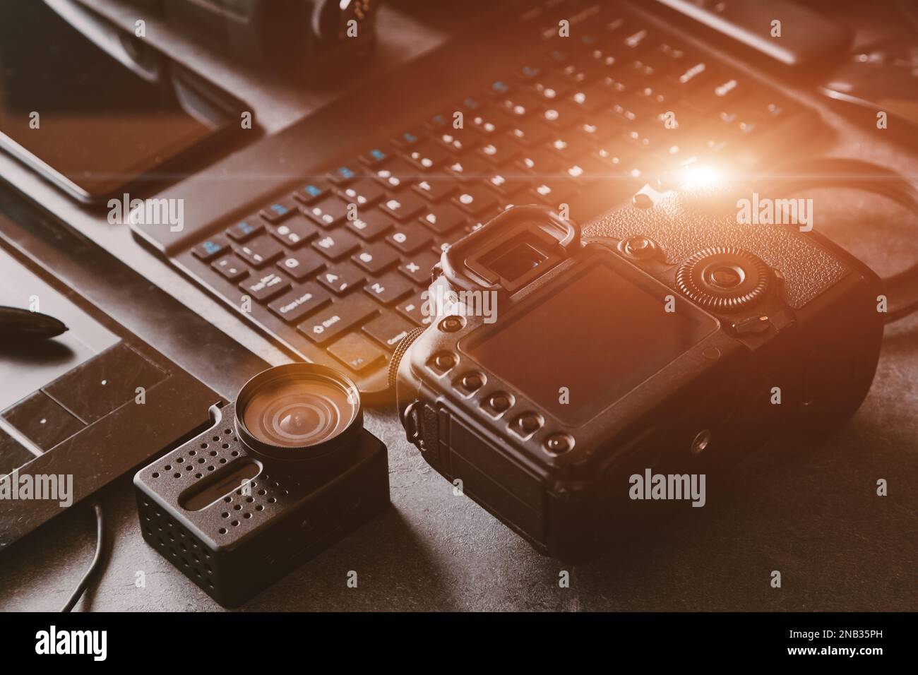 Digital photo workstation over black background.Top view of digital ...