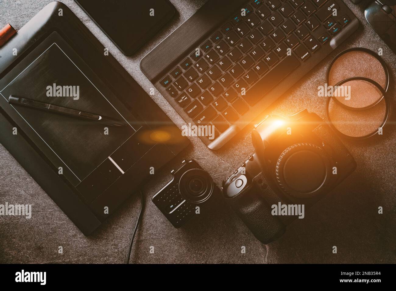 Digital photo workstation over black background.Top view of digital ...