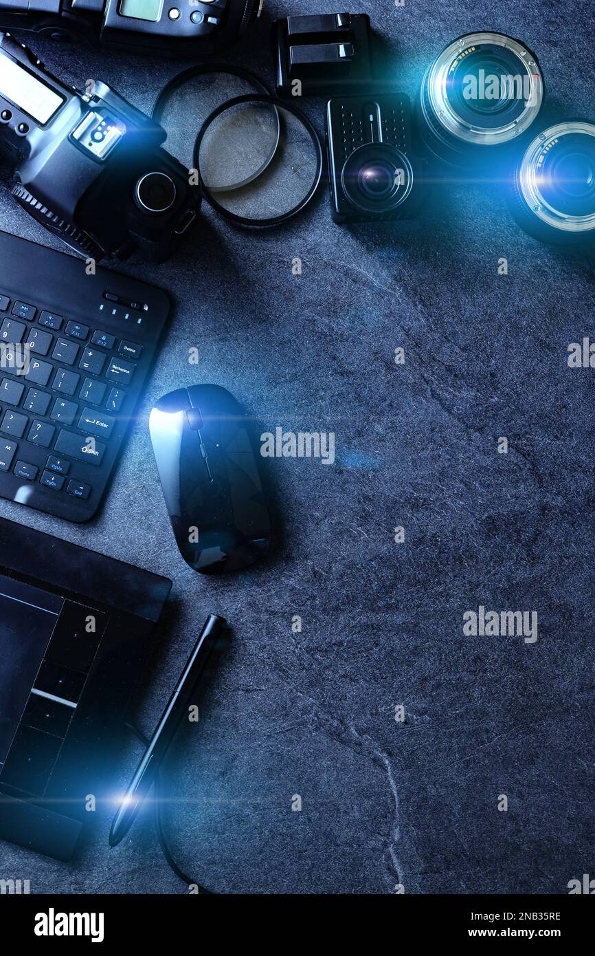 Digital photo workstation over black background.Top view of digital ...
