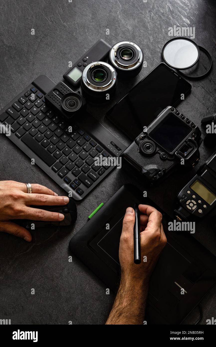 Digital photo workstation over black background.Top view of digital ...