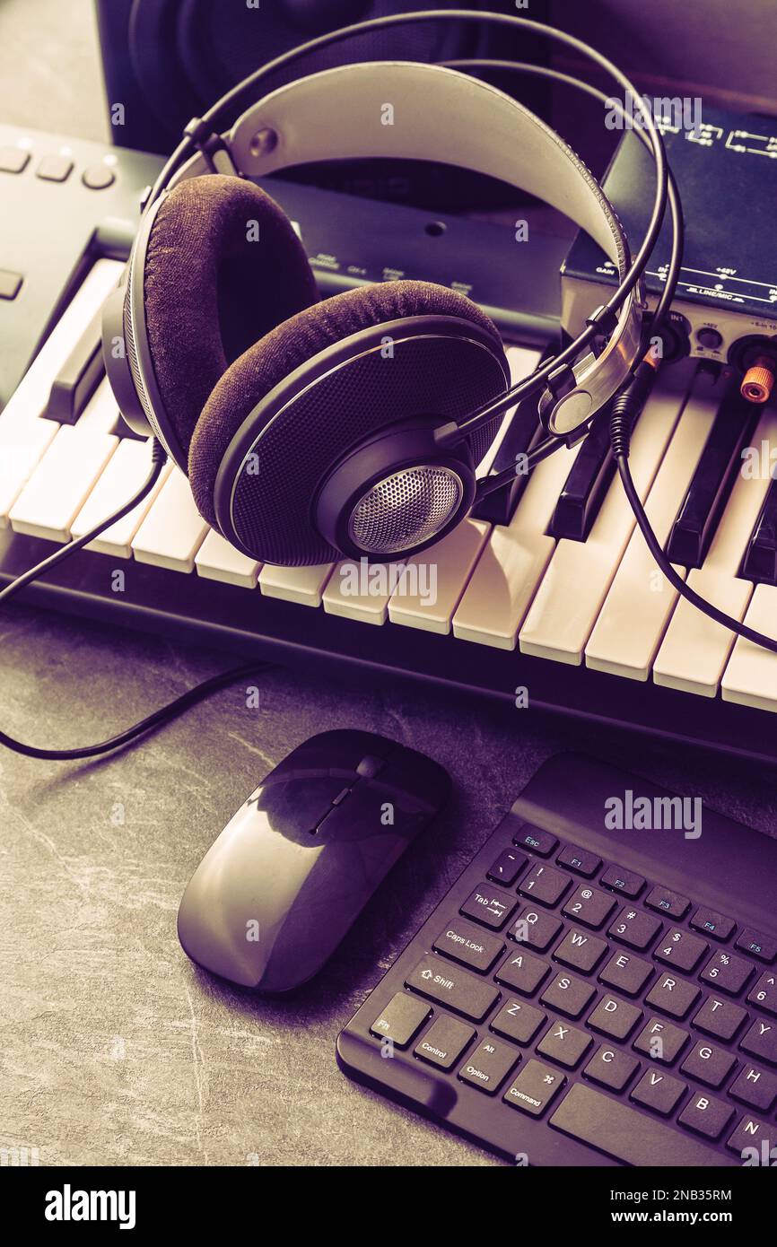 Keyboard Or Synthesizer With Headphones And Sound Card Computer