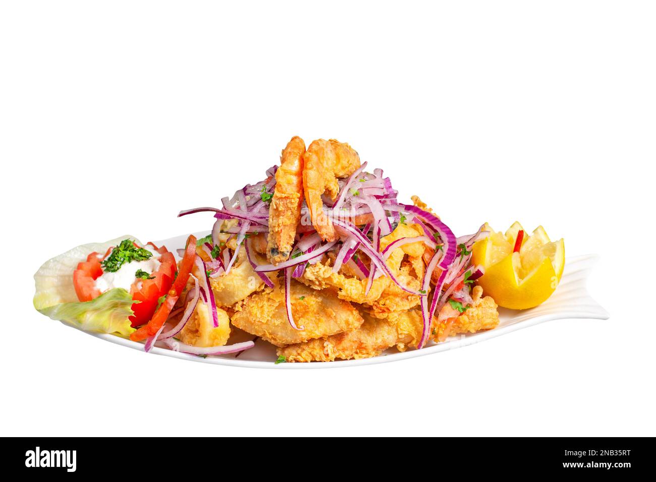 Peruvian traditional food. Fried fish with shrimp, onion, lemon ...