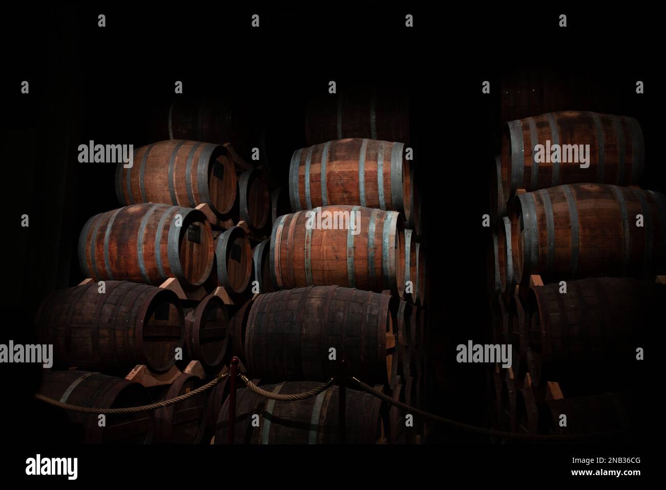 Stacked barrels in a dark room Stock Photo - Alamy