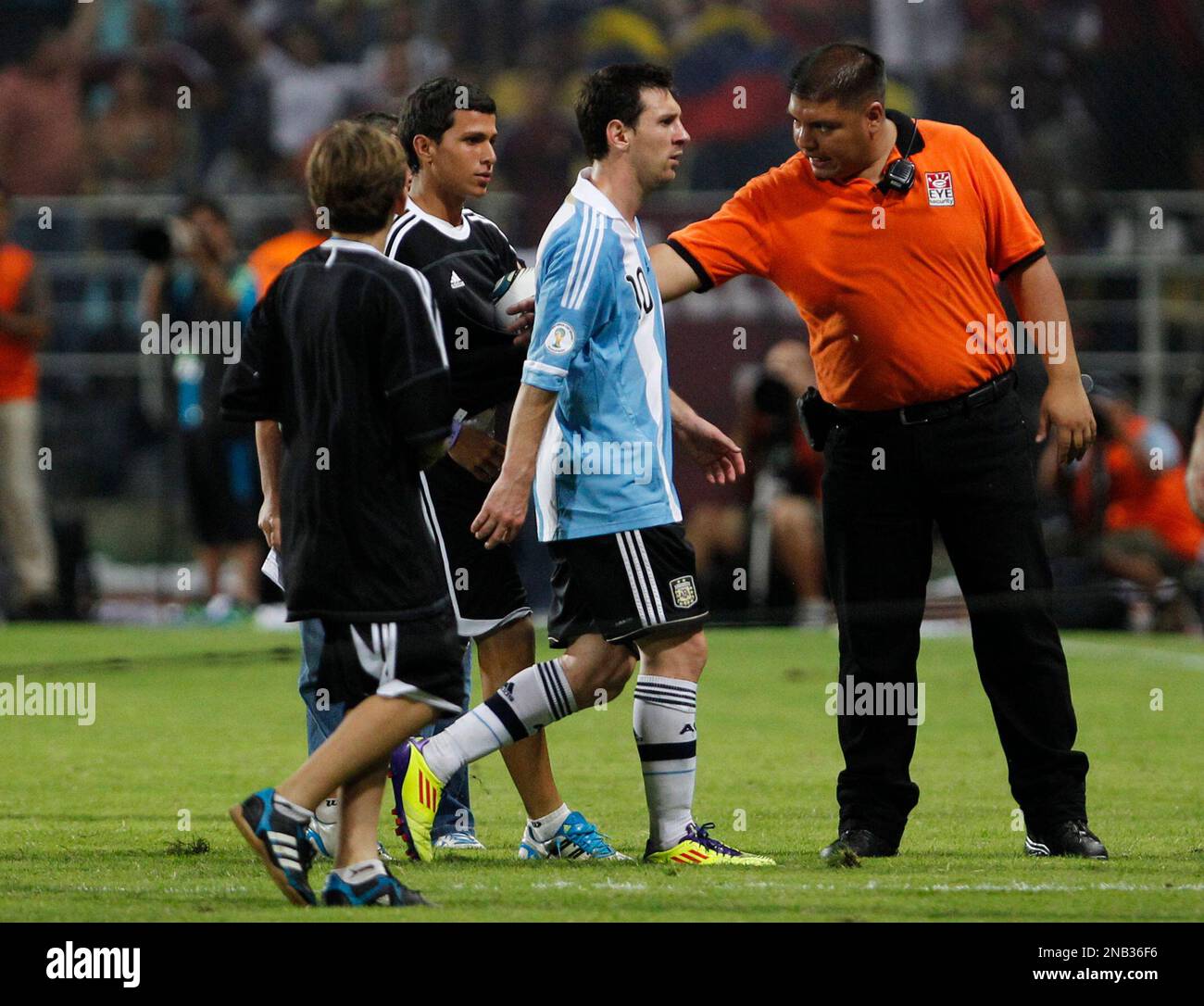 Argentina's Lionel Messi, center, leaves the field at the end of a 2014 ...