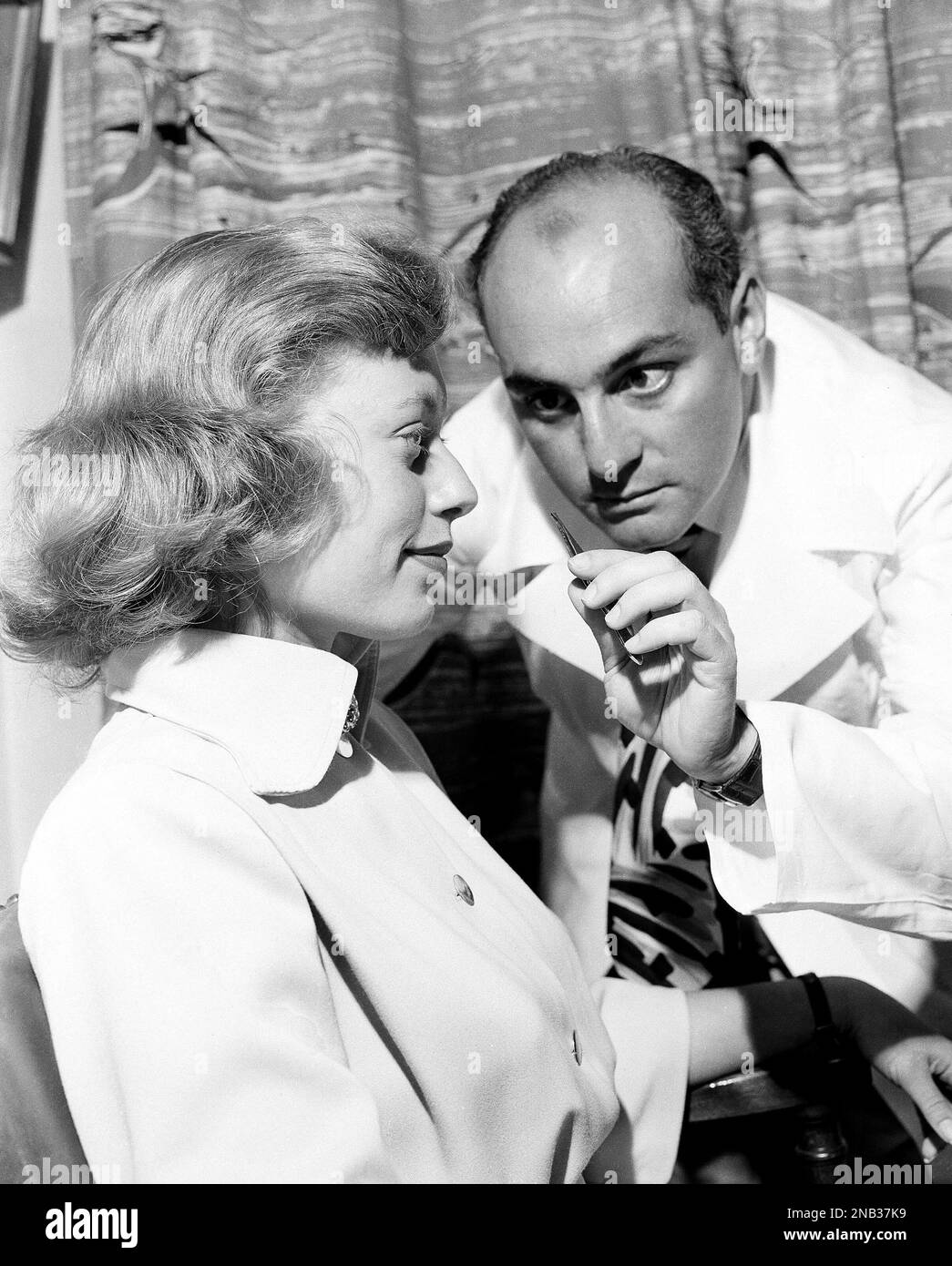 Dr. Robert Allyn Franklin, Hollywood plastic surgeon, checks model Fran ...