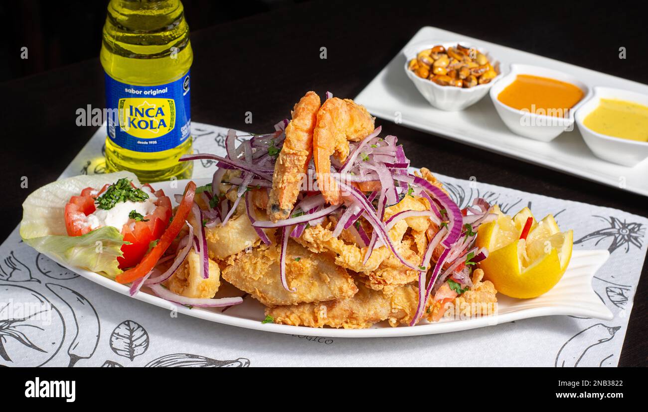 Cusco, Peru, 28.02.2021. Inca kola, peruvian soft drink and fried fish ...