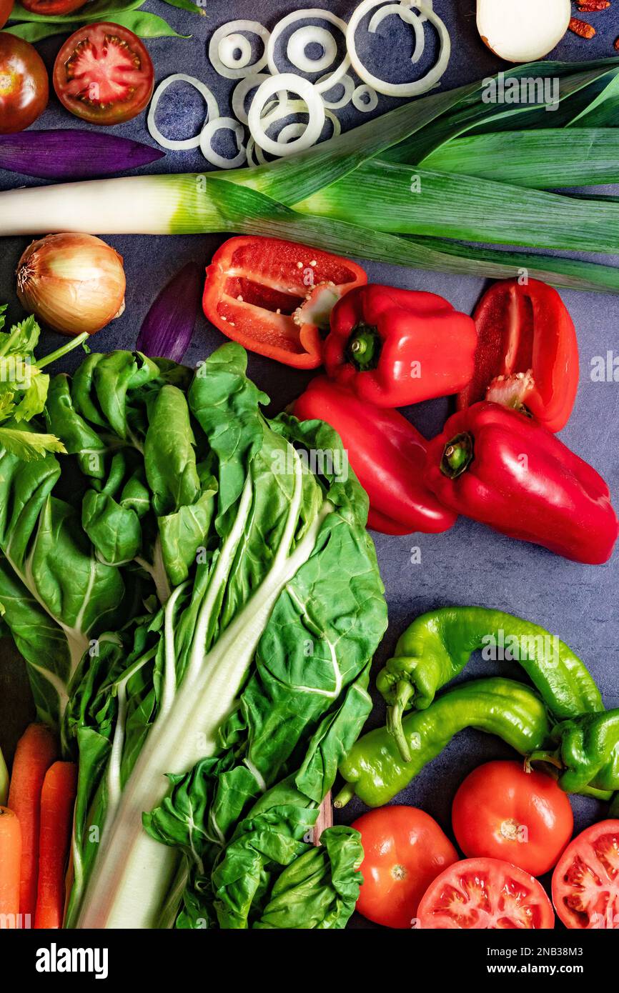 Healthy foods. Vegetables and fruits collection on black cement or stone background. Top view ...