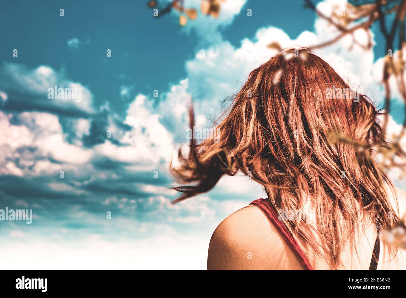 Romantic image of a young woman in the countryside with her hair ...