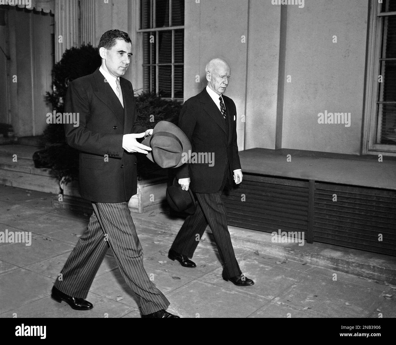Walking holding looking away authority building exterior hi-res stock ...