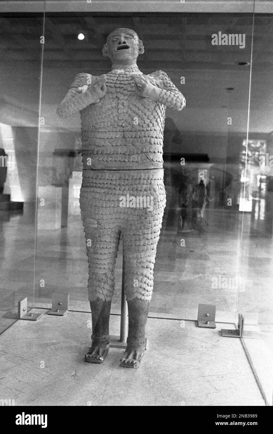 Terracotta figure of Xipe Totec, the Olmec “god of the flayed,” dated ...