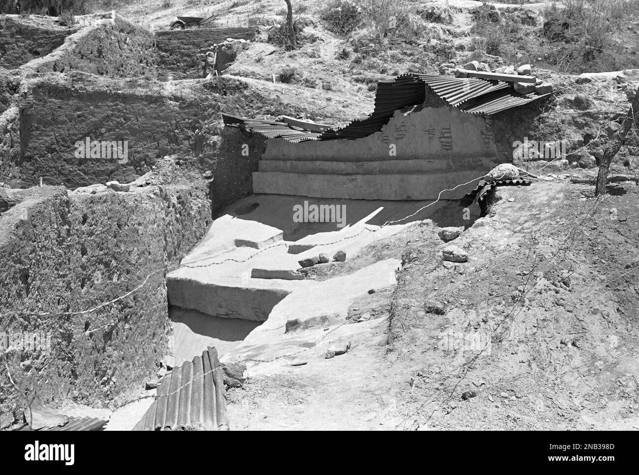 Wall of a pyramid with a stone altar, one of the few intact parts of ...