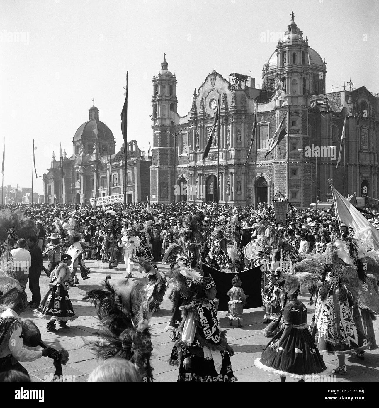 Clad in multicolored costumes, a group of Mexican Indians perform ...