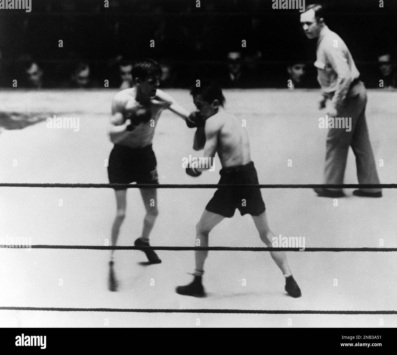 English boxer Judah Bergman, known as Jack Kid Berg, left, sending a ...
