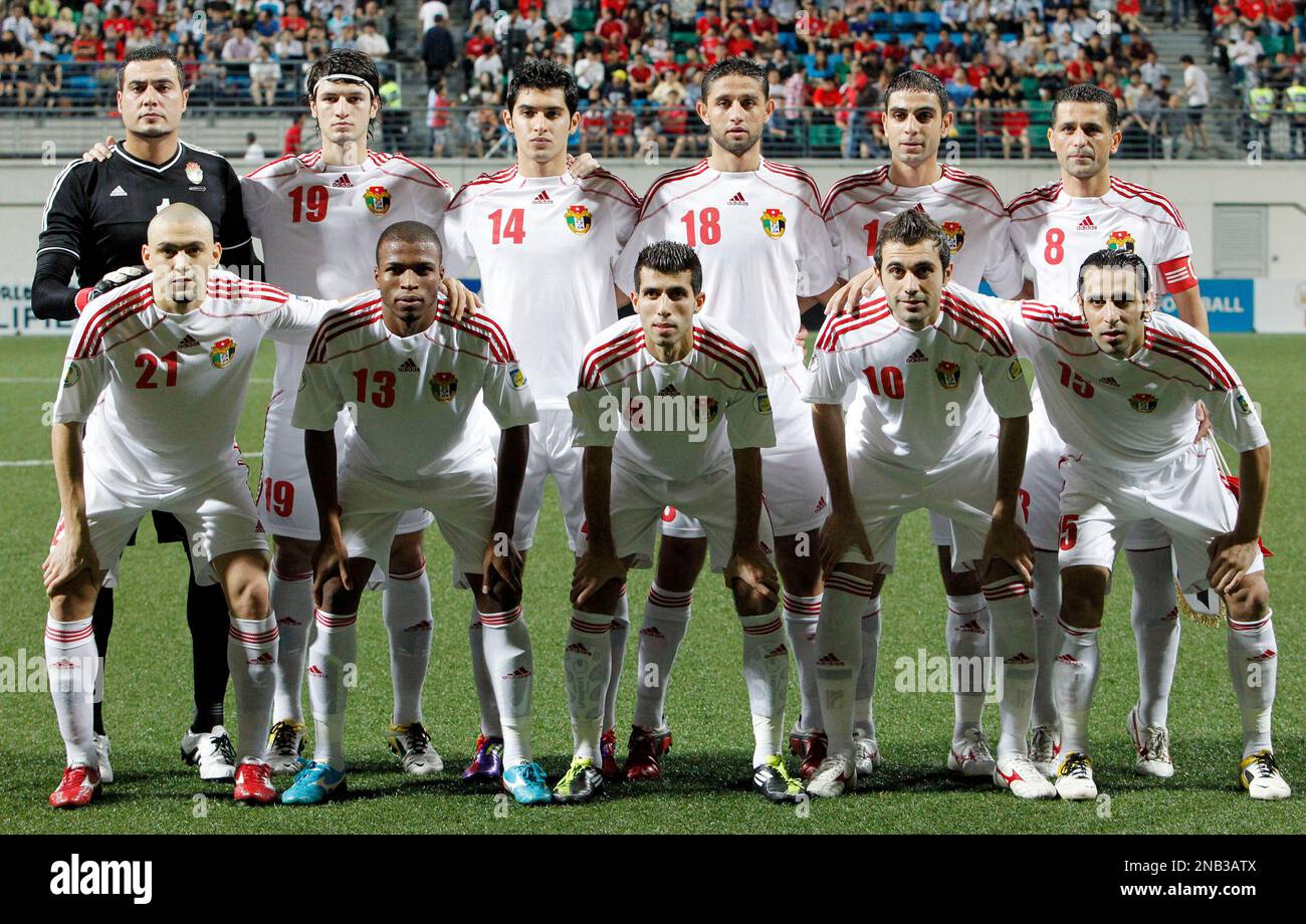 The Jordanian soccer team players pose for a team photo before their ...