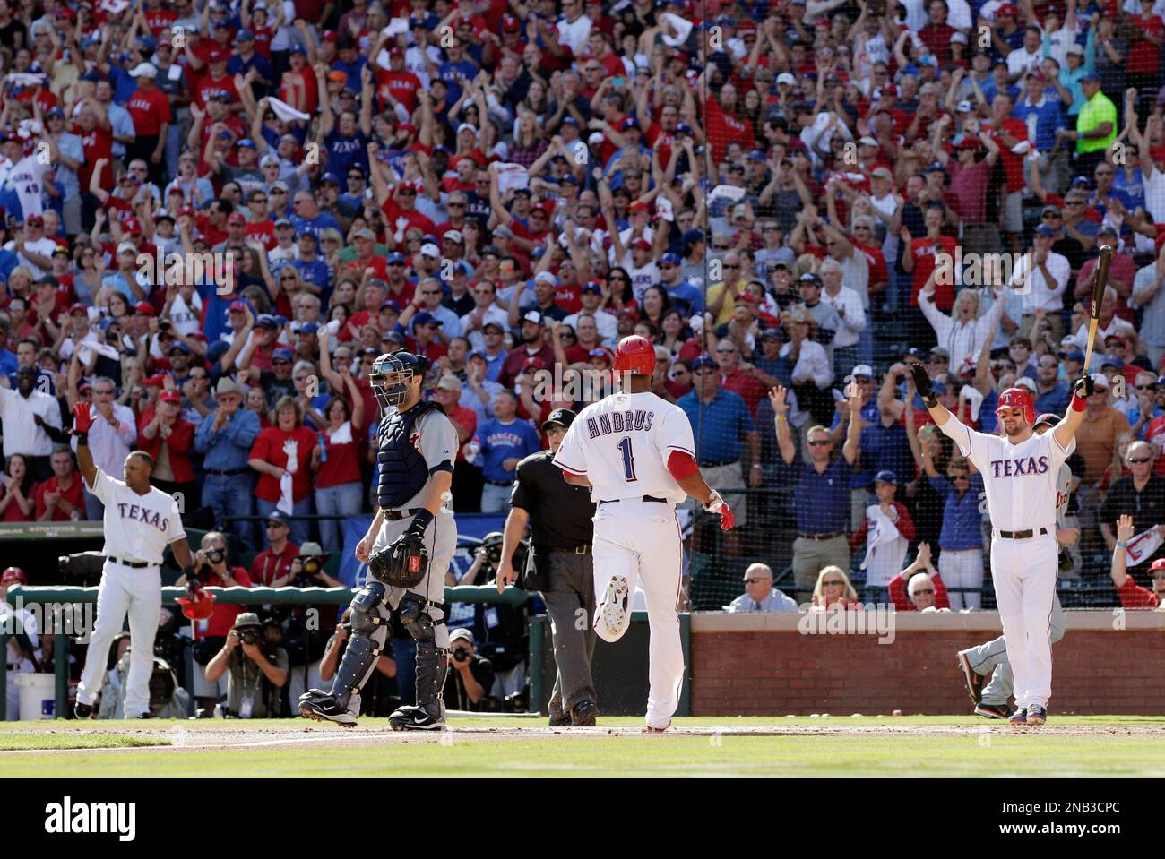 Texas Rangers' Elvis Andrus scores in front of Detroit Tigers' Alex ...