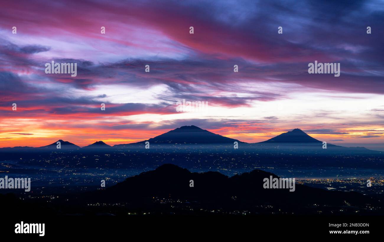 Beautiful dramatic reddish orange sunrise sky with mountain range ...