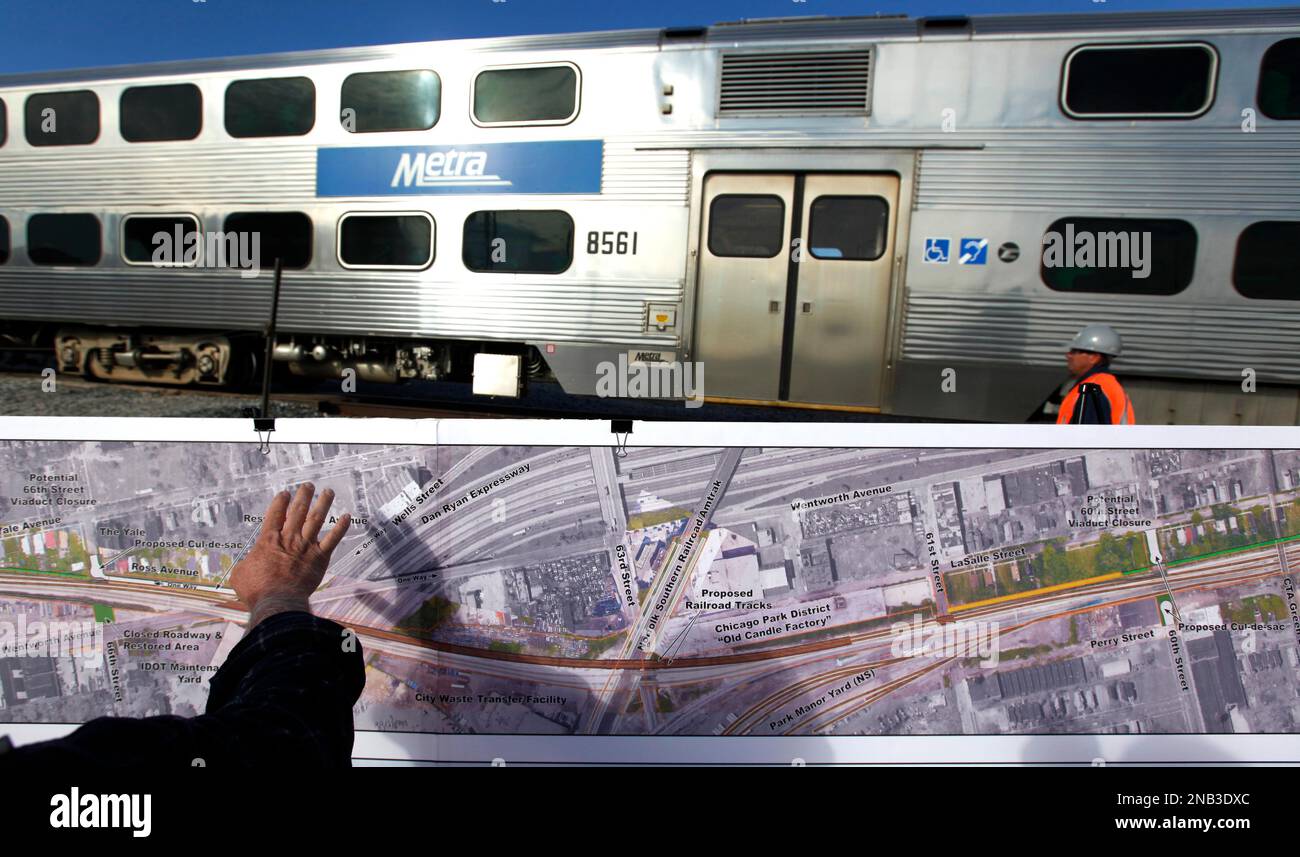 A Metra commuter train passes by a rendering of the $133 million ...