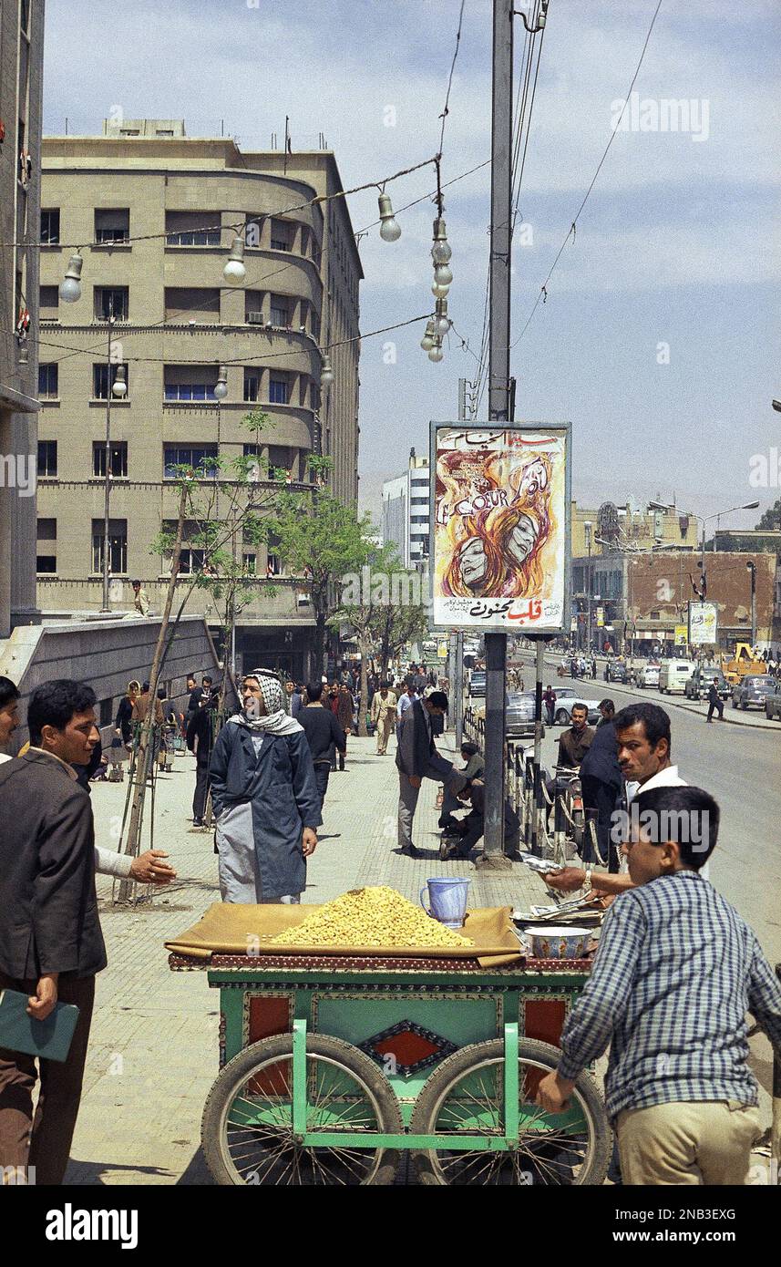 Street vendors crowd the sidewalks of Damascus, Syria, April 23, 1972 ...