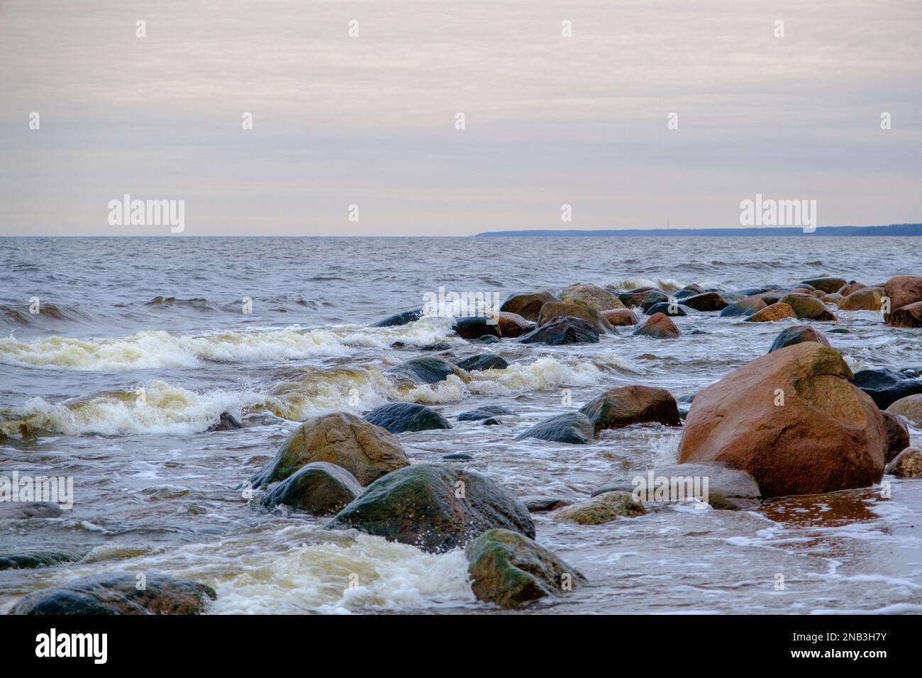 Rocky Baltic Sea beach in Latvia. Spring is approaching, nature is ...
