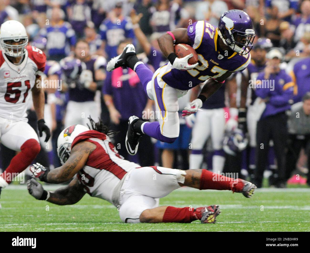 Minnesota Vikings running back Lorenzo Booker (27) is upended by ...