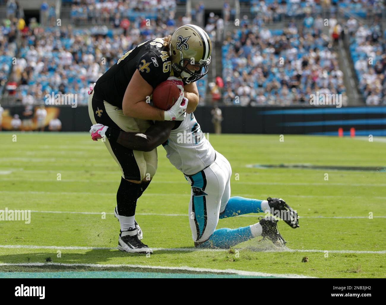 New Orleans Saints' Jed Collins (45) drives past Carolina Panthers ...