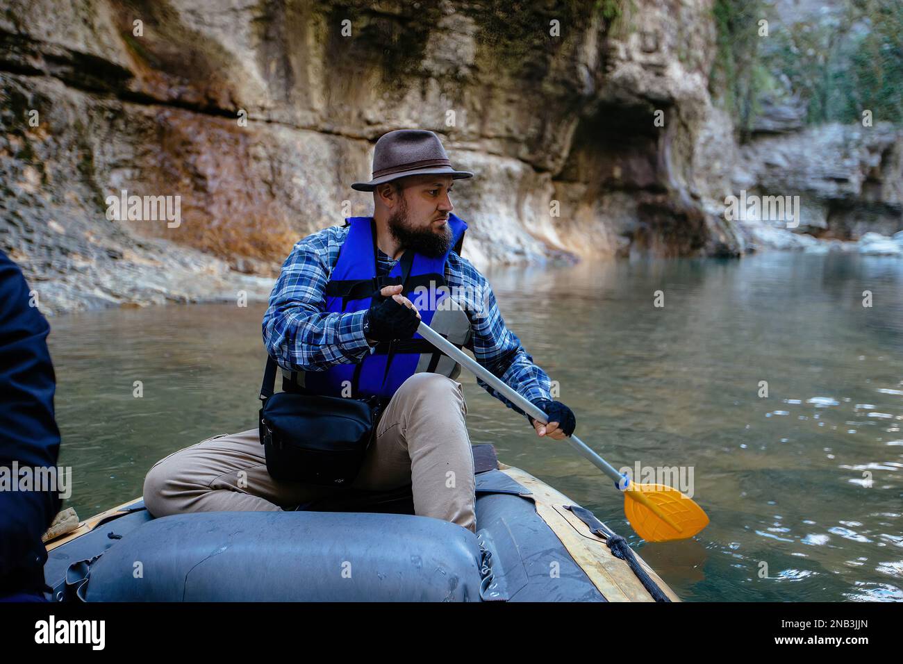 Man in rafting boat in the canyon Stock Photo - Alamy