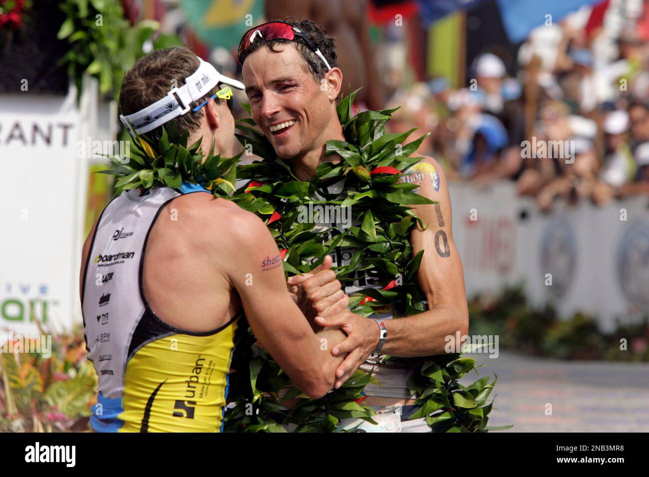 Ironman athlete Pete Jacobs (left) of Australia and Andreas Raelert of ...