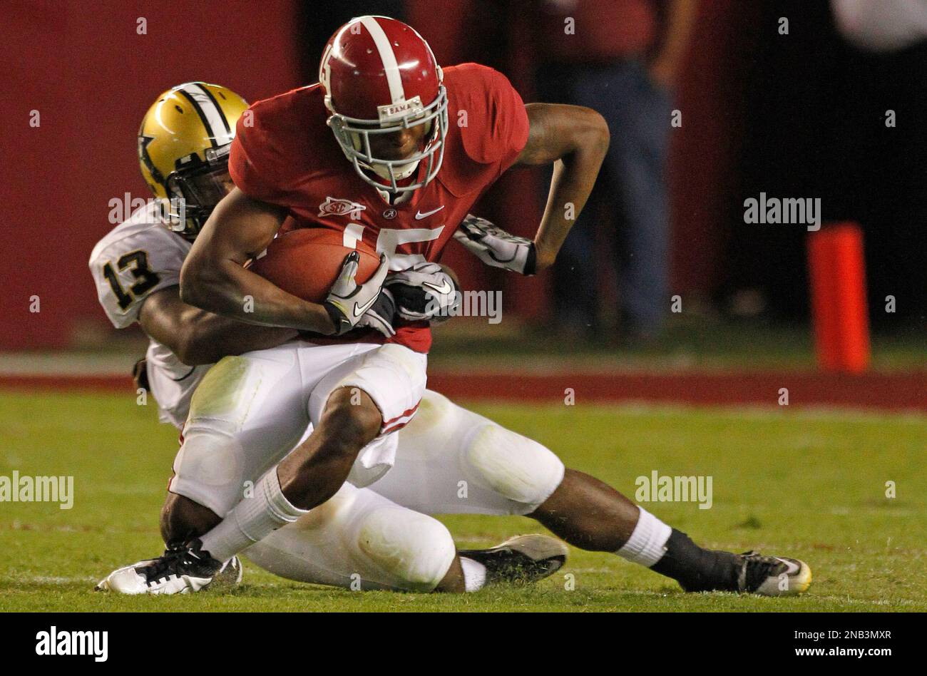 Vanderbilt linebacker Chris Marve (13) pulls down Alabama wide receiver ...