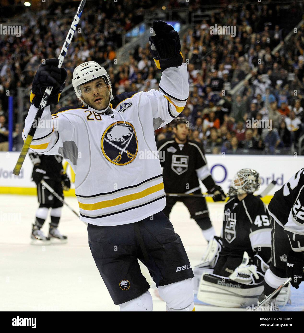 Buffalo Sabres' Buffalos Paul Gaustad, left, reacts after scoring ...