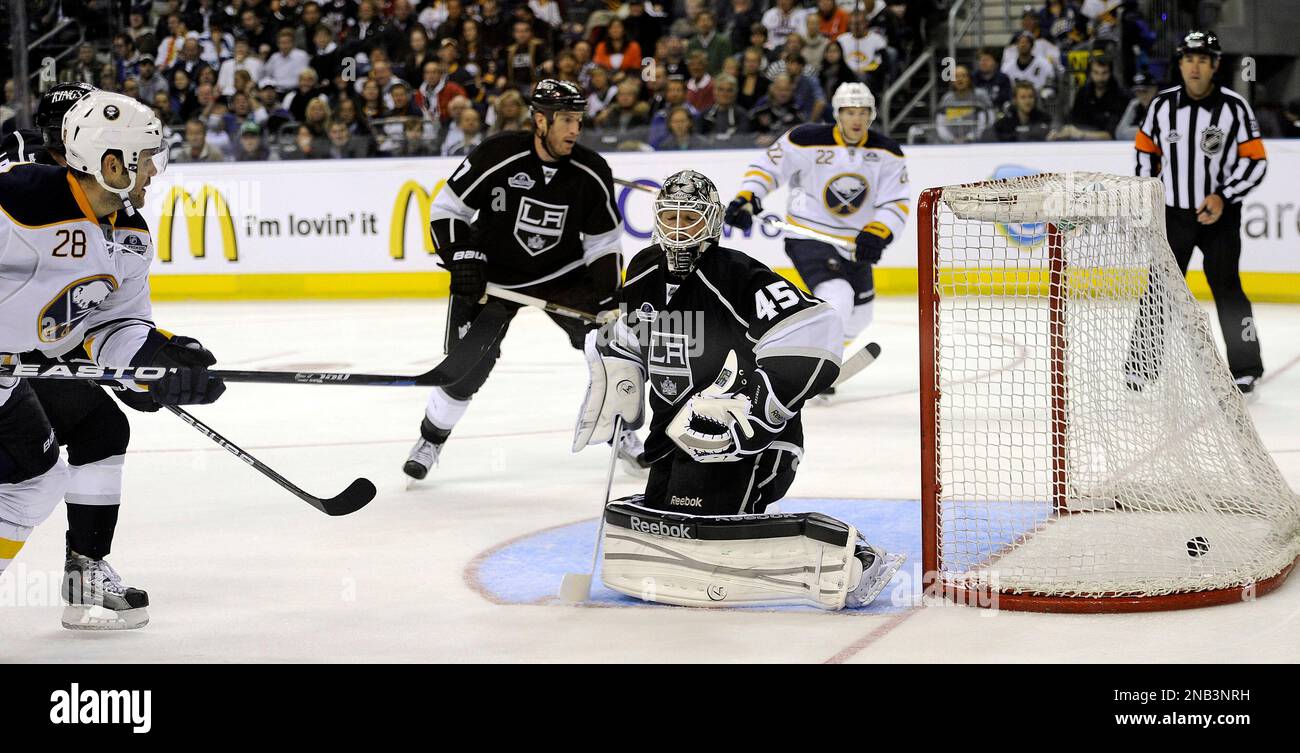 Buffalo Sabres' Buffalos Paul Gaustad, left, scores against the LA ...