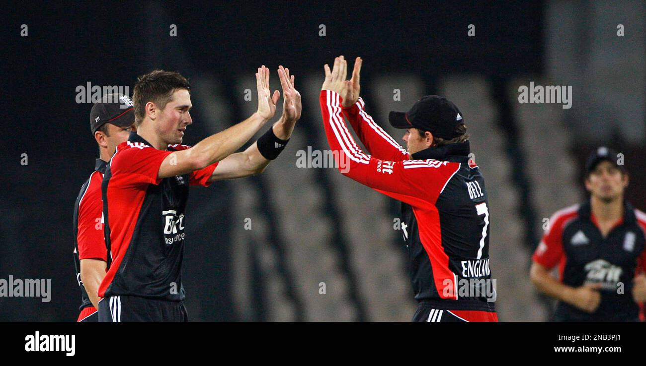 England XI bowler Chris Woakes, left, celebrates with teammates Ian ...