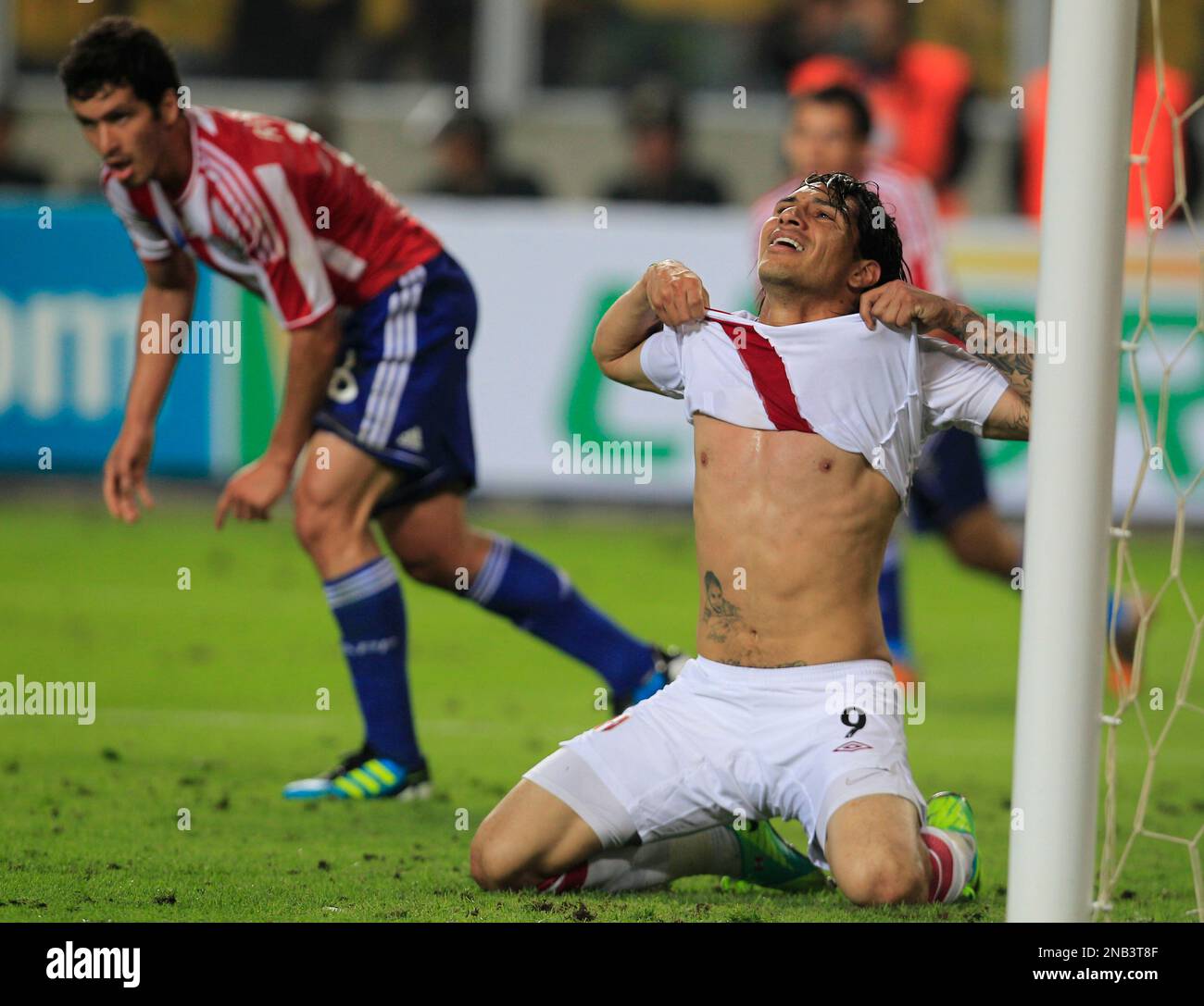 Peru's Paolo Guerrero, right, reacts after missing a chance to score as ...
