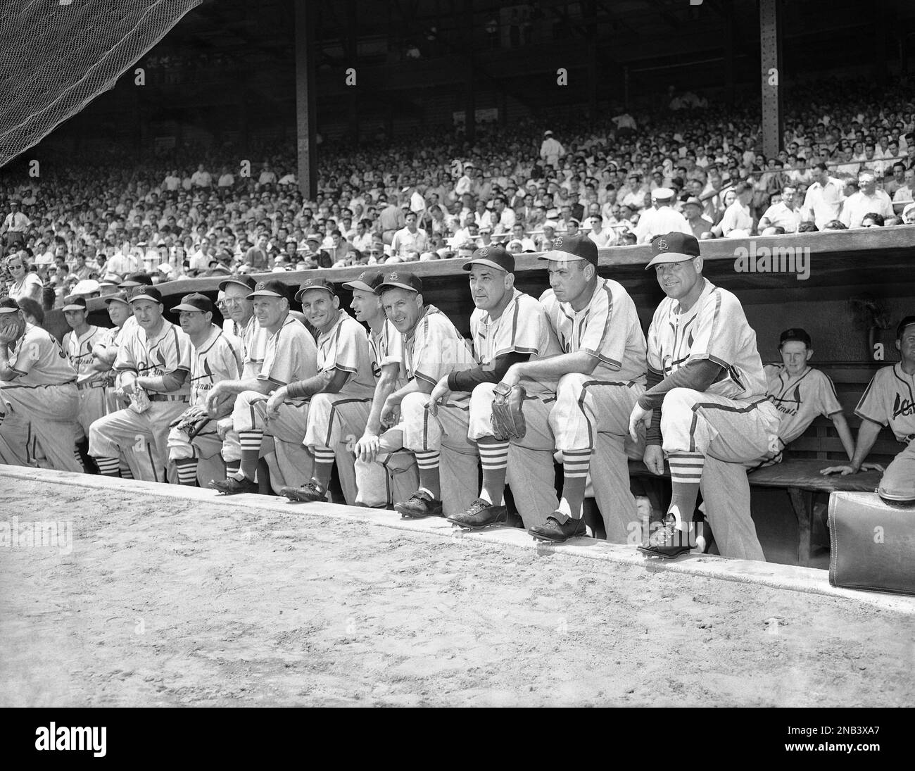 Ten members of old St. Louis Cardinals “Gas House Gang” pose at edge of ...