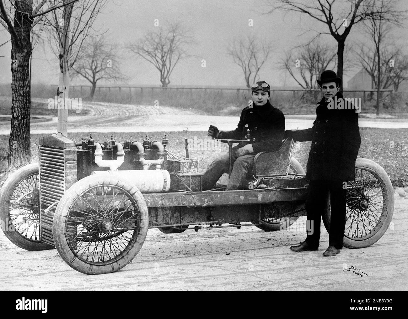 Henry Ford stands beside Old 999, his first contribution to automobile ...