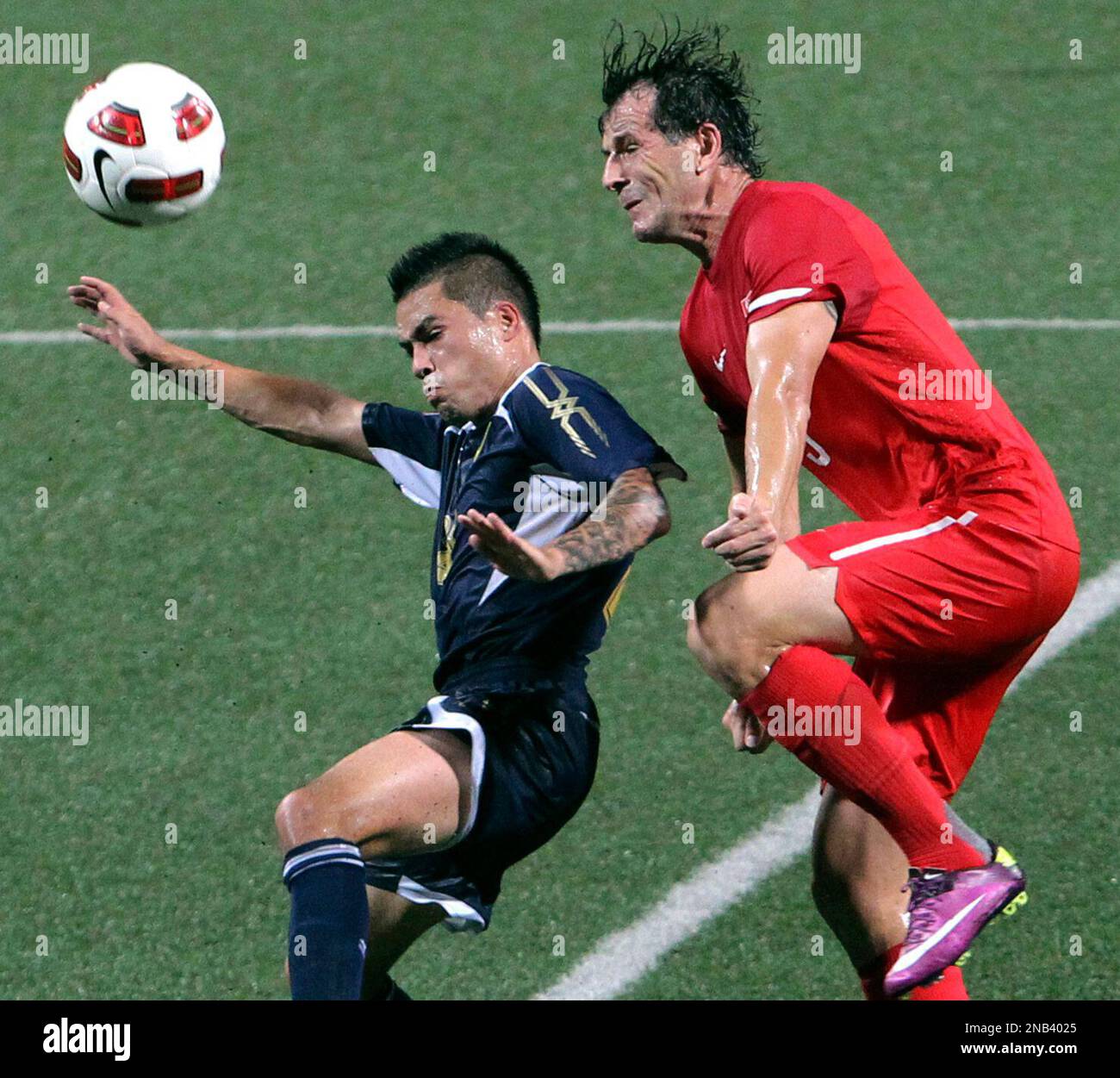 Jason De Jong of Philippines, left, and Aleksandar Duric of Singapore ...