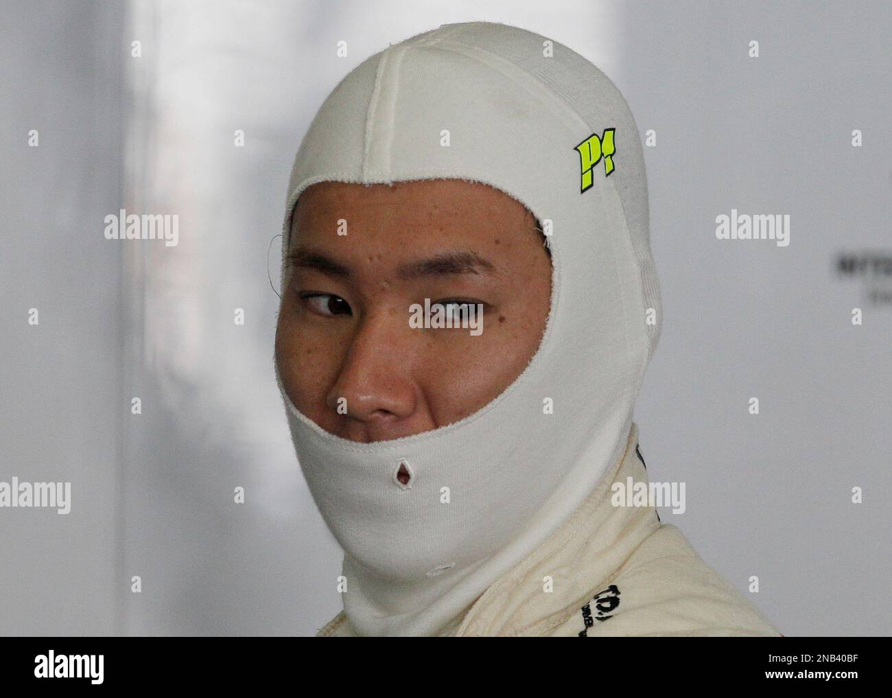 Sauber driver Kamui Kobayashi of Japan waits in the pits before the ...