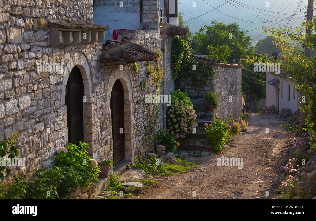 The quiet street with historical stone houses of the old town of Berat ...