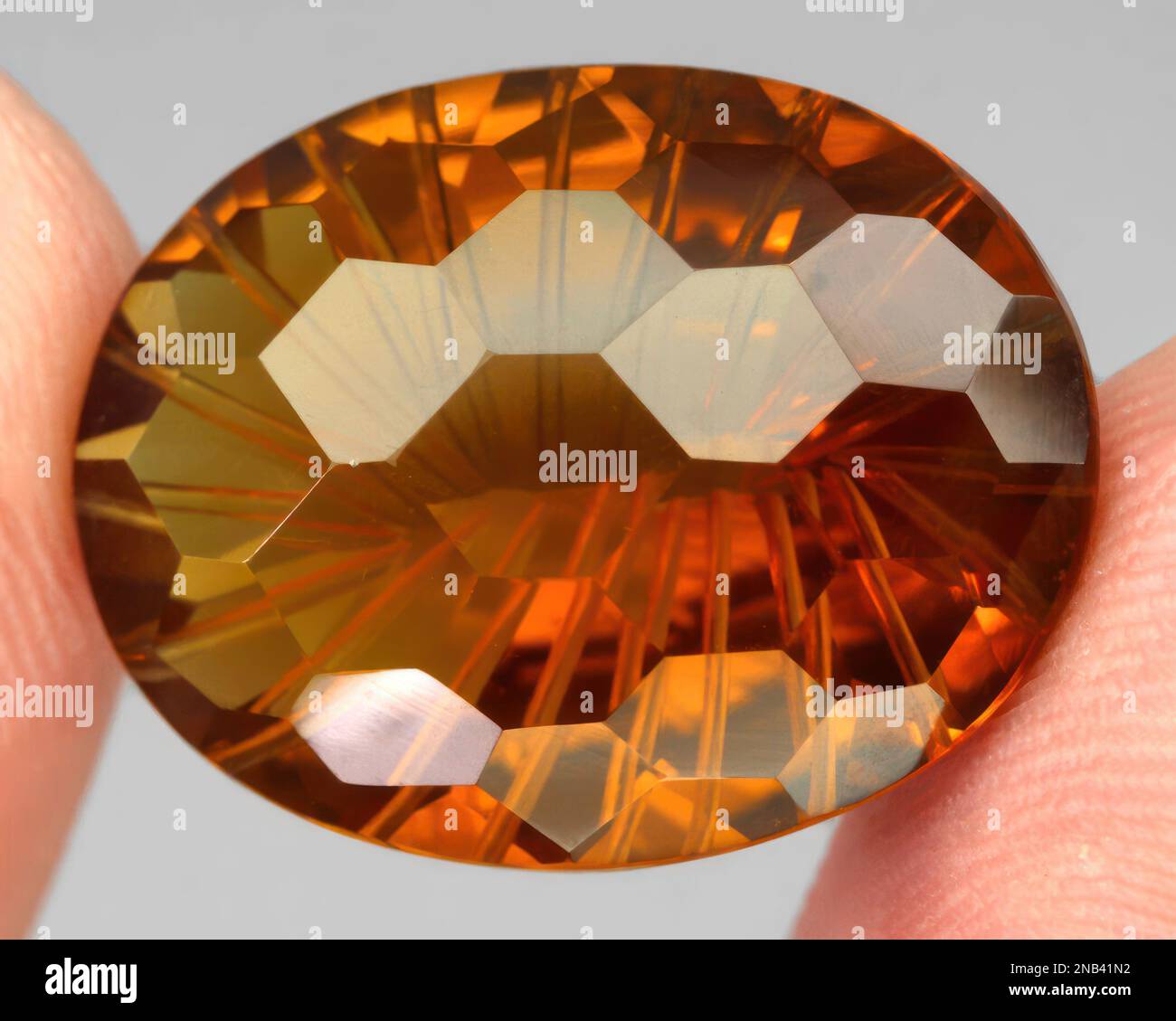 Natural gemstone wine imperial topaz on a gray background Stock Photo ...