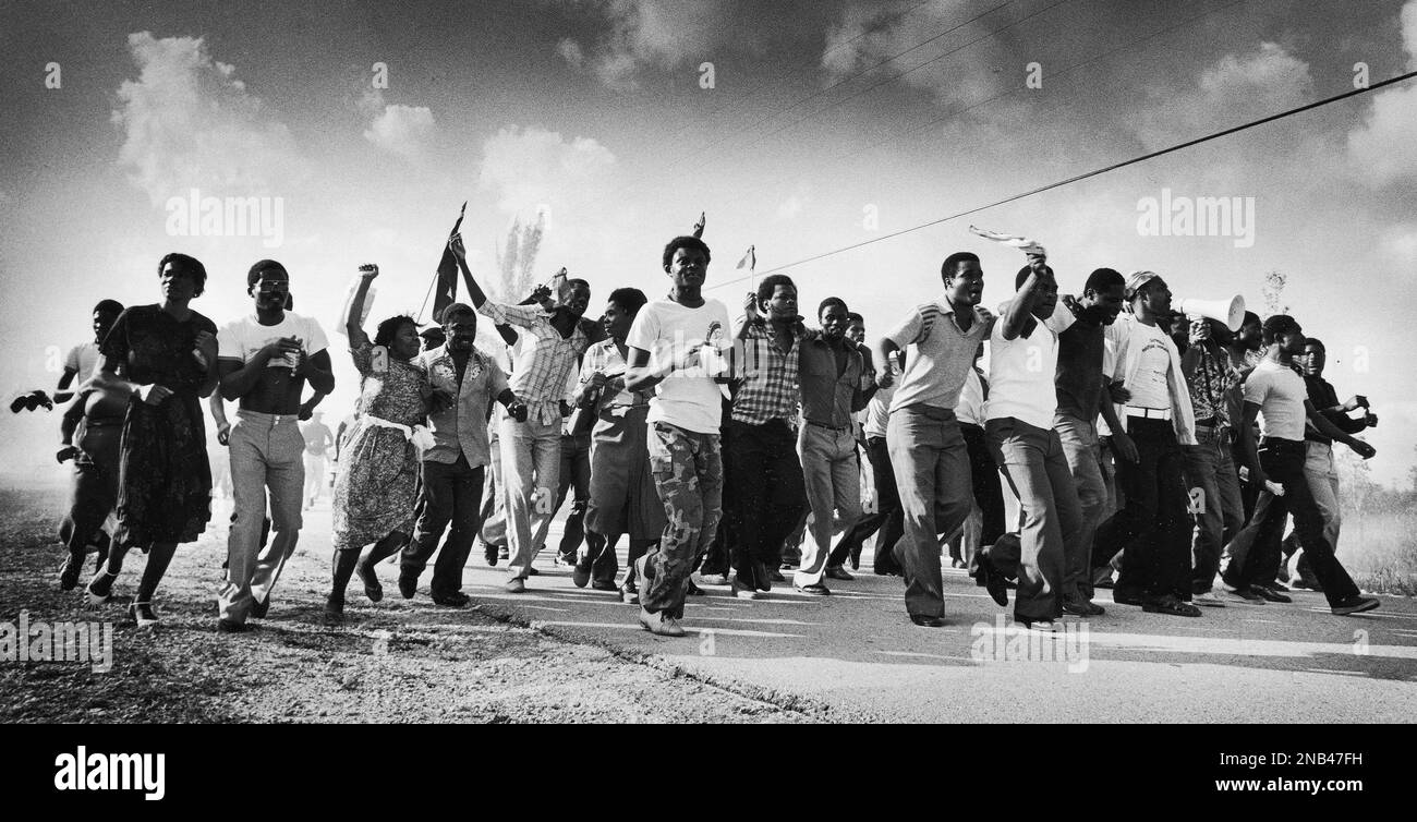 Haitian demonstrators run through tear gas at Krome Detention Center ...
